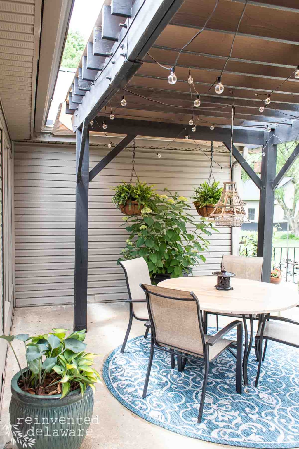 How to Install a DIY Sun Shade Sail for a Patio - Reinvented Delaware